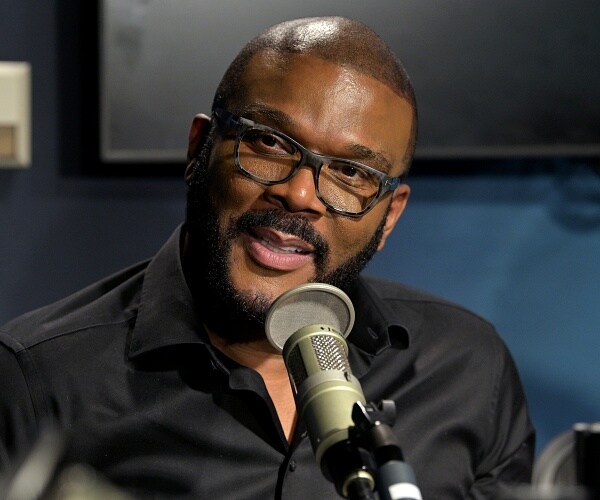 Cars Line up for Miles for Tyler Perry Atlanta Food Giveaway | Newsmax.com