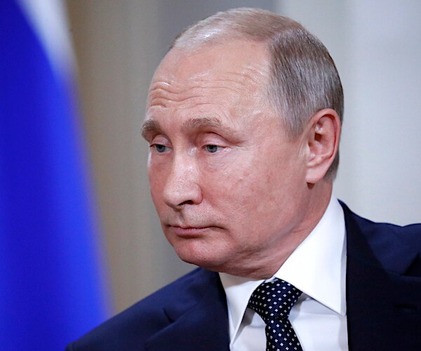 Vladimir Putin Waves Off Reading Indictment in Interview | Newsmax.com