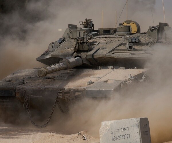Israeli Tanks Kill 59 People in Gaza Crowd Trying to Get Food Aid ...