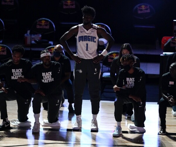 Magic Forward Isaac Defies Trend, Stands During National Anthem ...