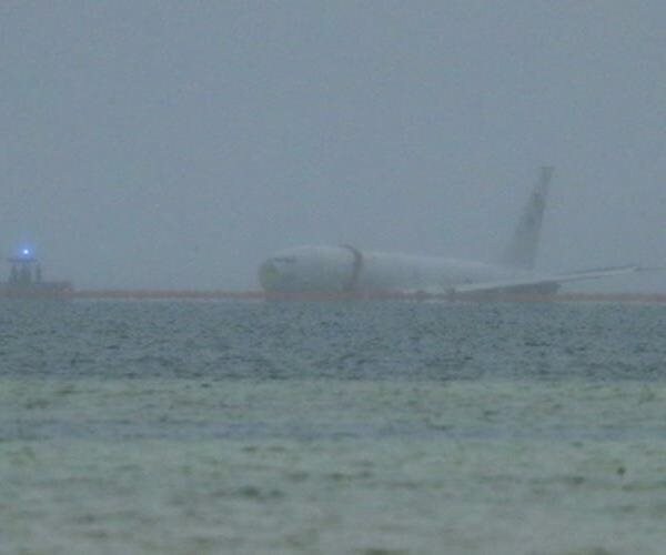 Navy Plane Overshoots Runway, Ends up in Ocean, but All 9 Aboard Escape ...