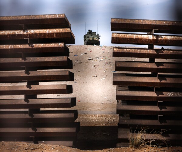 Judge Tosses Charges Against Migrants Caught in Military Zone | Newsmax.com