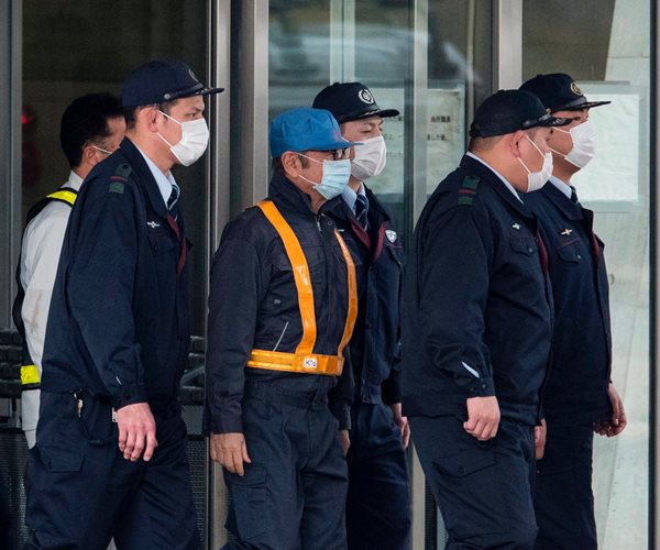 Ghosn Freed on Bail in Cap, Face Mask After 108 Days in Jail | Newsmax.com