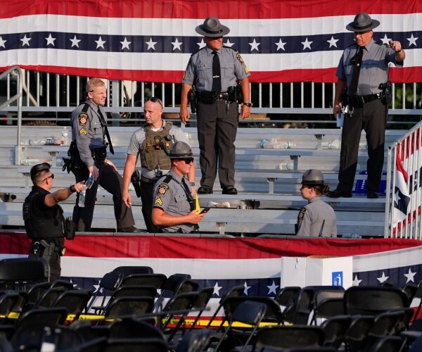 Witness: Saw Armed Man on Roof Before Shots Rang Out | Newsmax.com