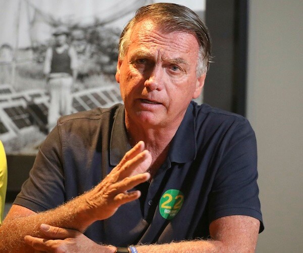 Brazil's Bolsonaro Dons MAGA Hat, Cheers Trump's 2024 Win | Newsmax.com