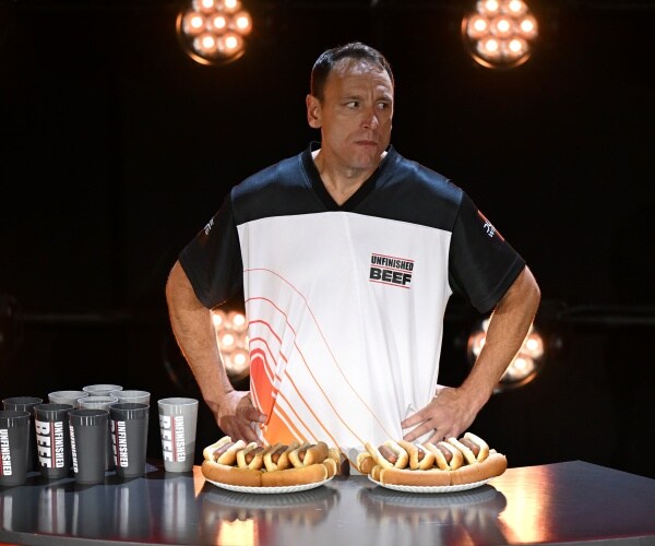 Joey Chestnut Sets World Record by Downing 83 Hot Dogs | Newsmax.com