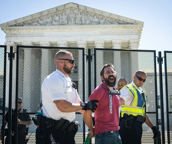 Abortion Rights Protester Locks Neck to U.S. Supreme Court Fence ...